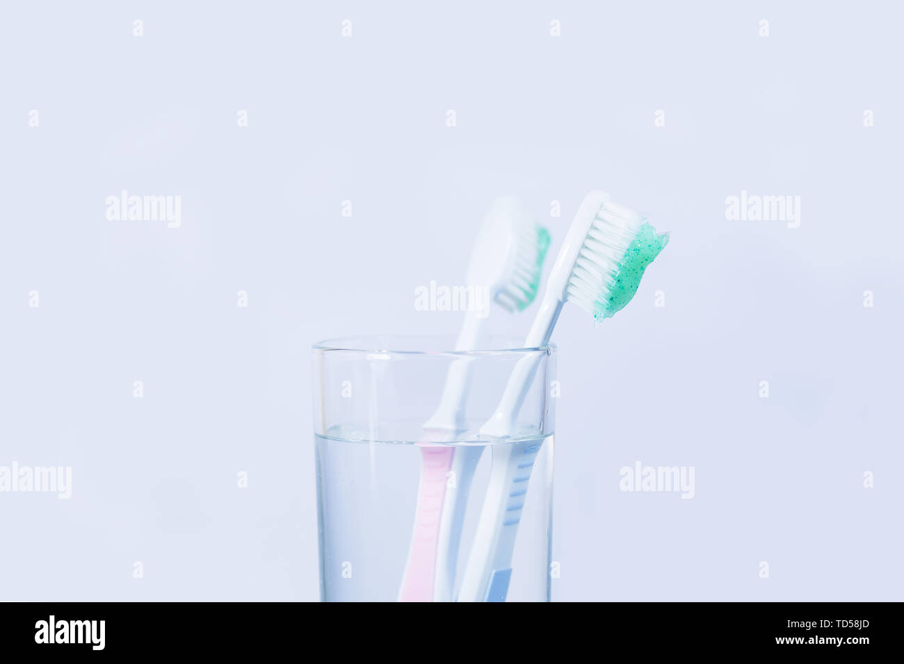 Toothbrush, toothpaste, glass Stock Photo - Alamy