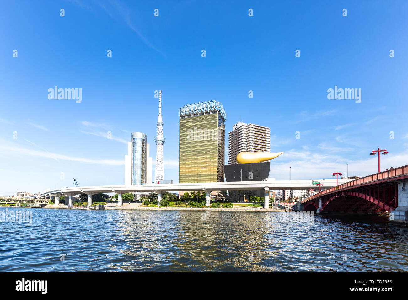 bridge,water,modern buildings and tokyo tower in blue sky Stock Photo ...