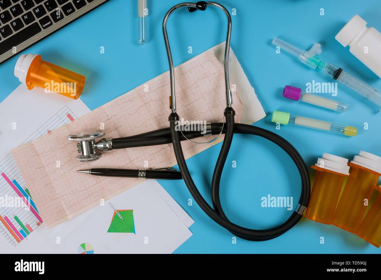 Cardiogram EKG graph on a with medical stethoscope healthcare stats ...