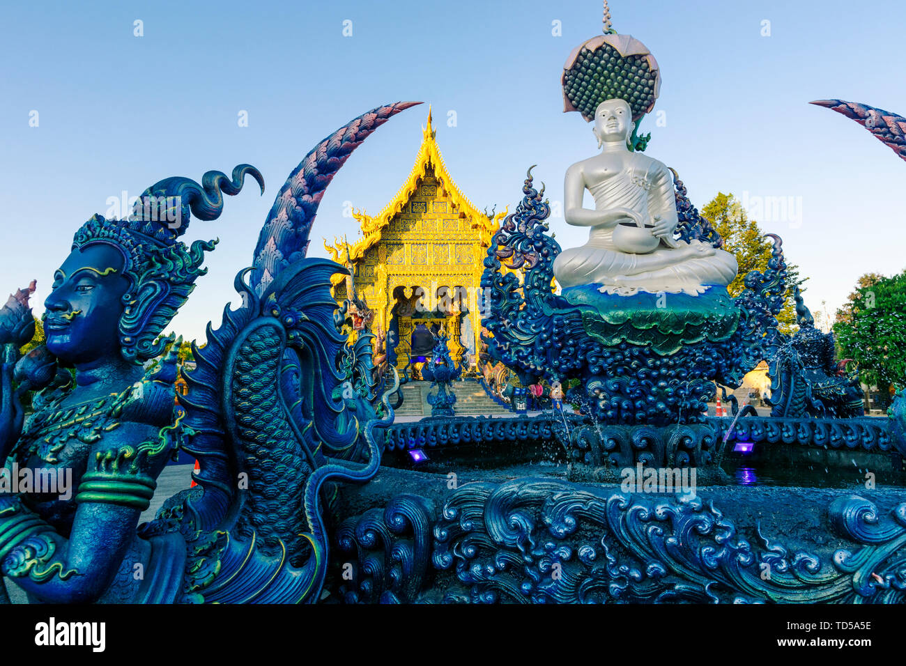 Fountain and front entrance of Wat Rong Suea Ten (Blue Temple) in ...