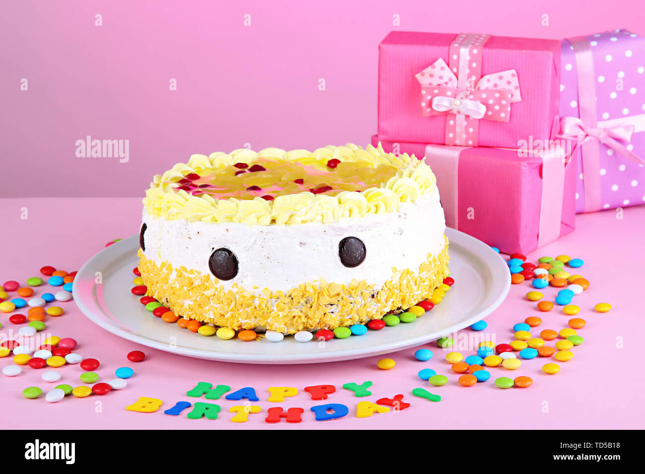 Happy birthday cake and gifts, on pink background Stock Photo - Alamy