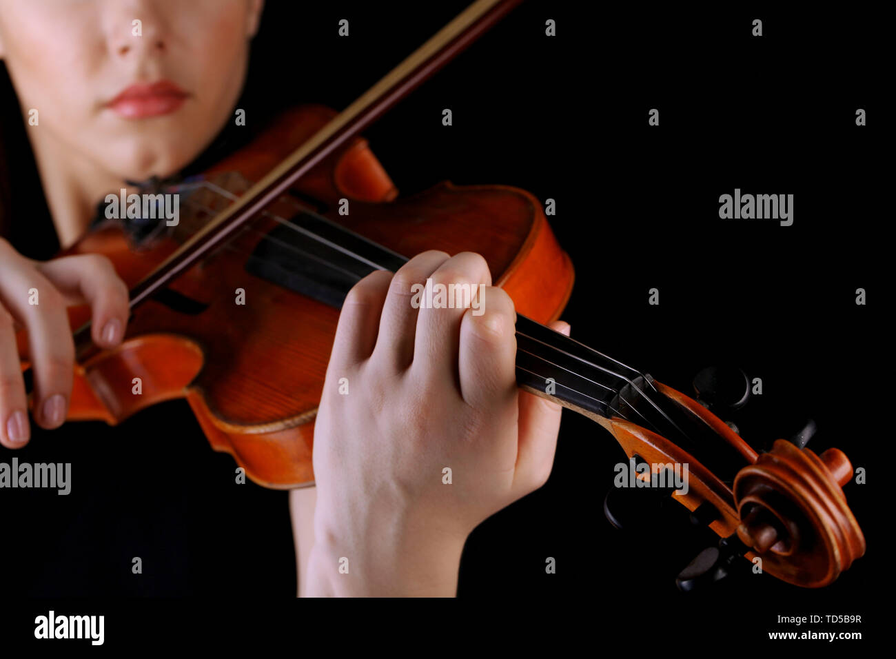 Musician playing violin on black background Stock Photo - Alamy