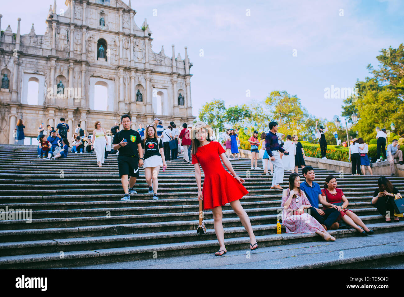Red dress tour the big three buses Stock Photo - Alamy