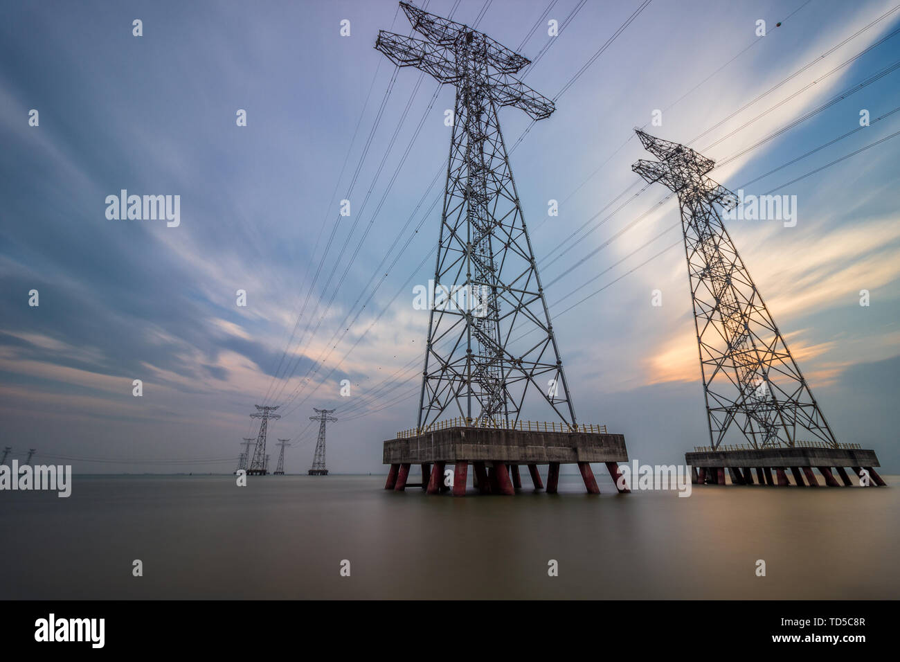 High-voltage electric transmission cable on the surface of the sea ...