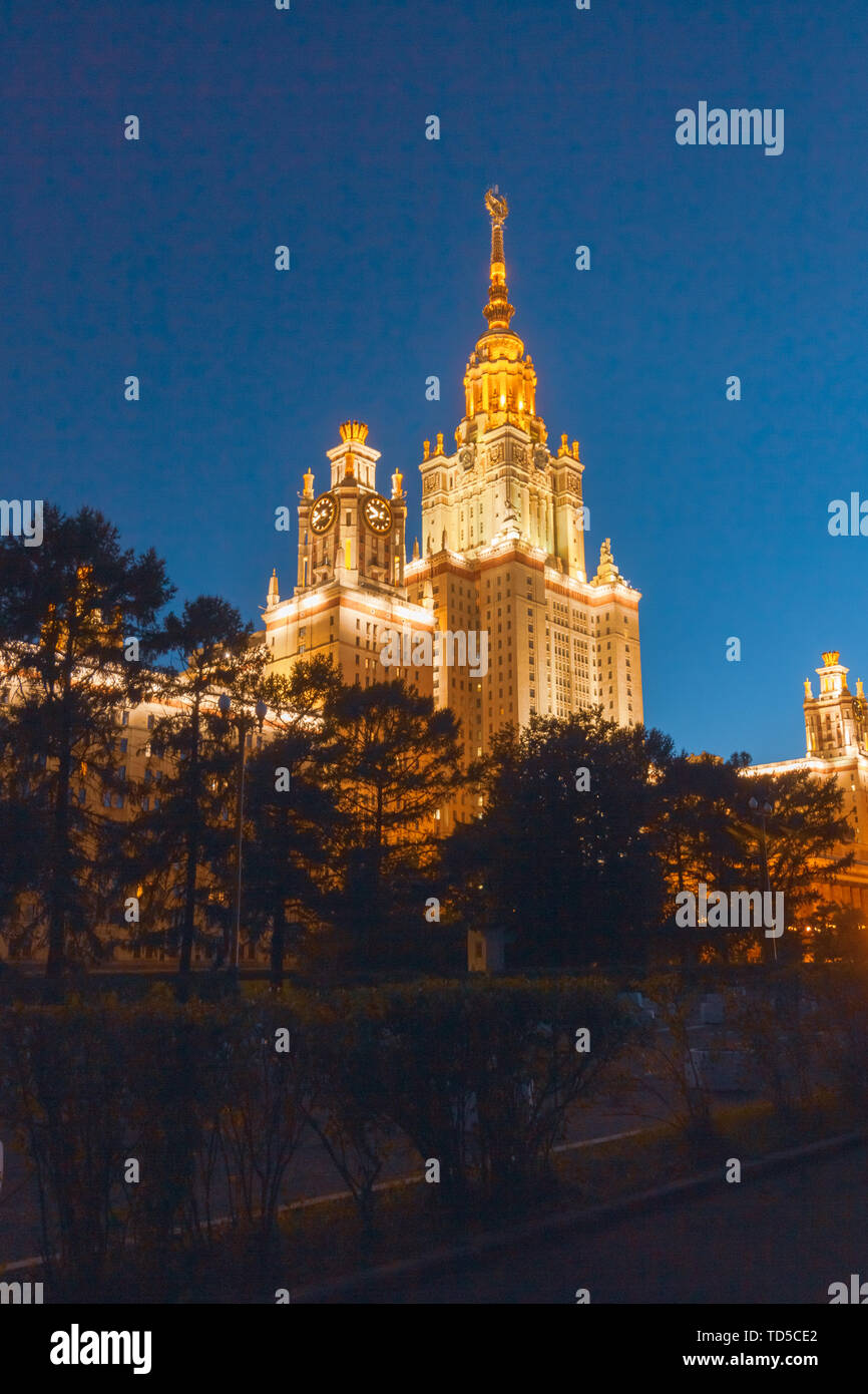 Soviet skyscraper of Stalinist architecture at night at blue hour with ...