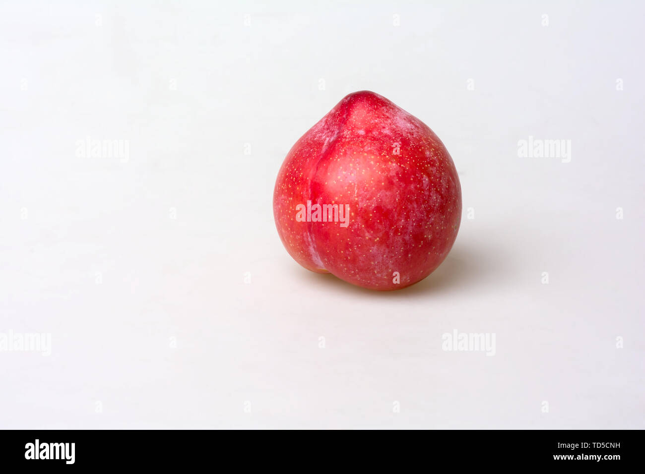 red peach on white background Stock Photo - Alamy