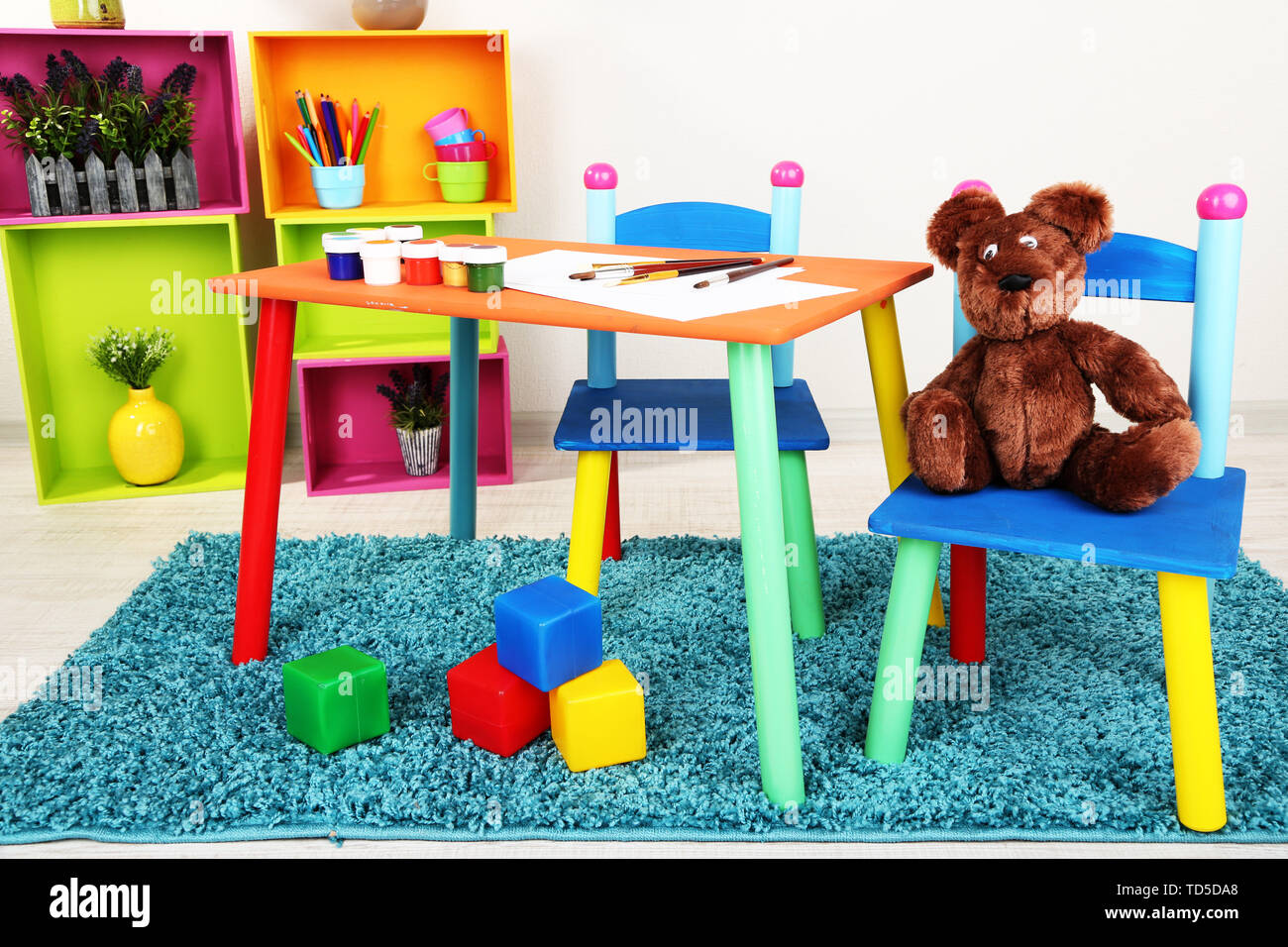 Small and colorful table and chairs for little kids Stock Photo - Alamy