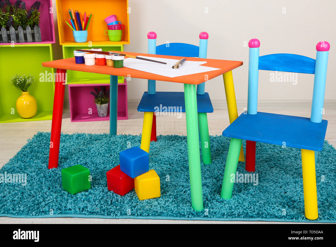 Small and colorful table and chairs for little kids Stock Photo - Alamy