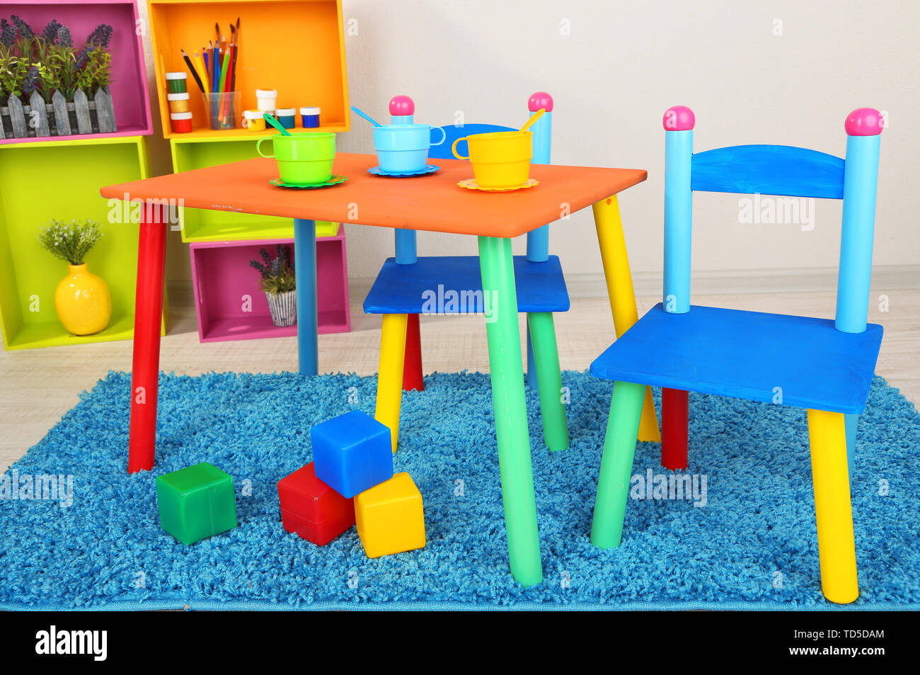 Small and colorful table and chairs for little kids Stock Photo - Alamy