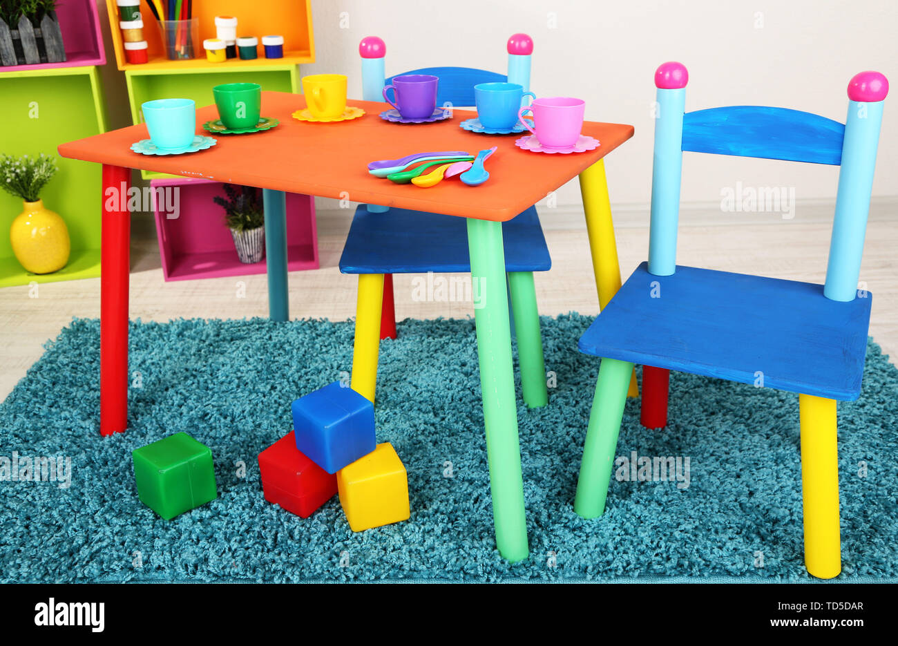 Small and colorful table and chairs for little kids Stock Photo - Alamy