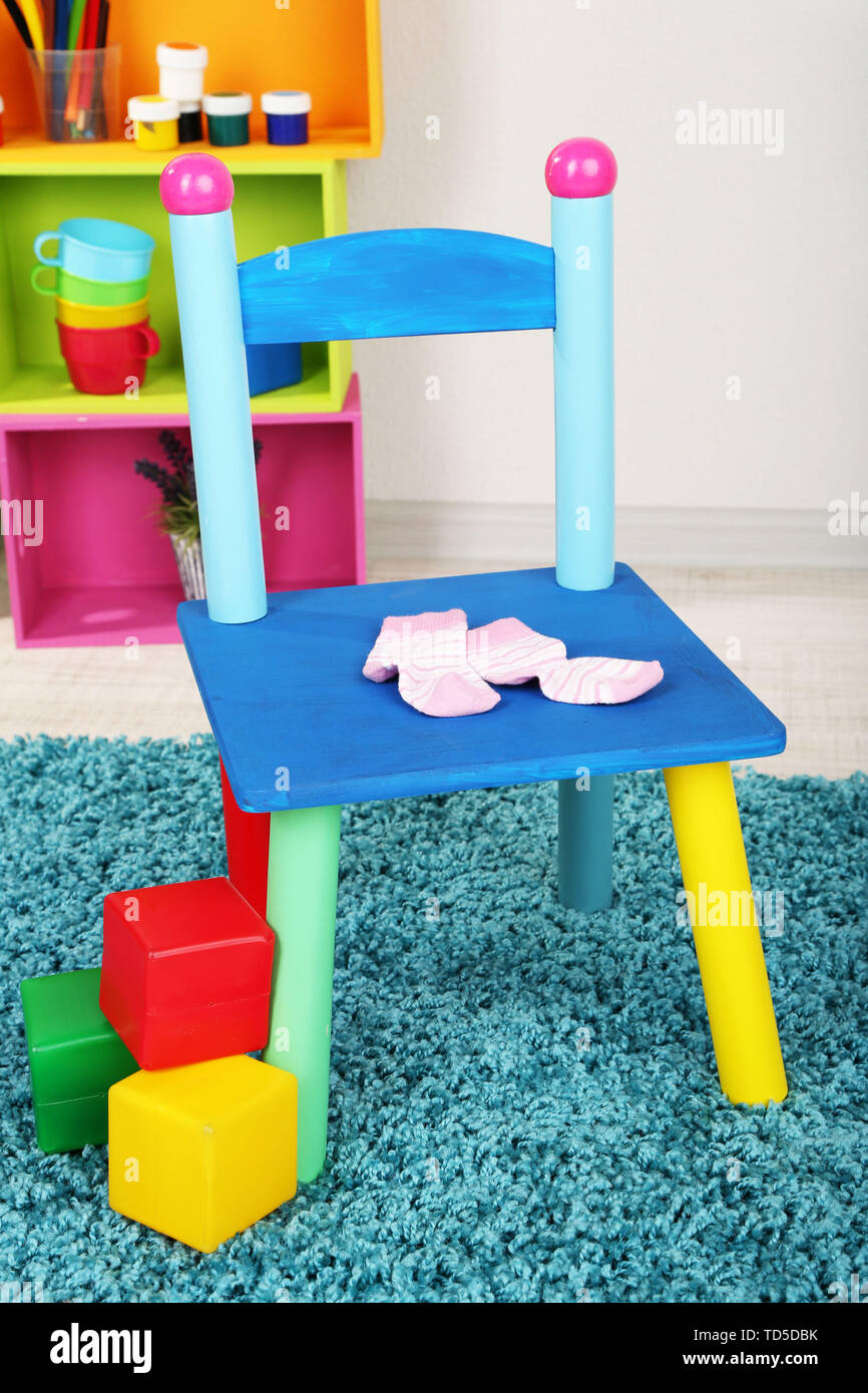 Small and colorful chair for little kids Stock Photo - Alamy