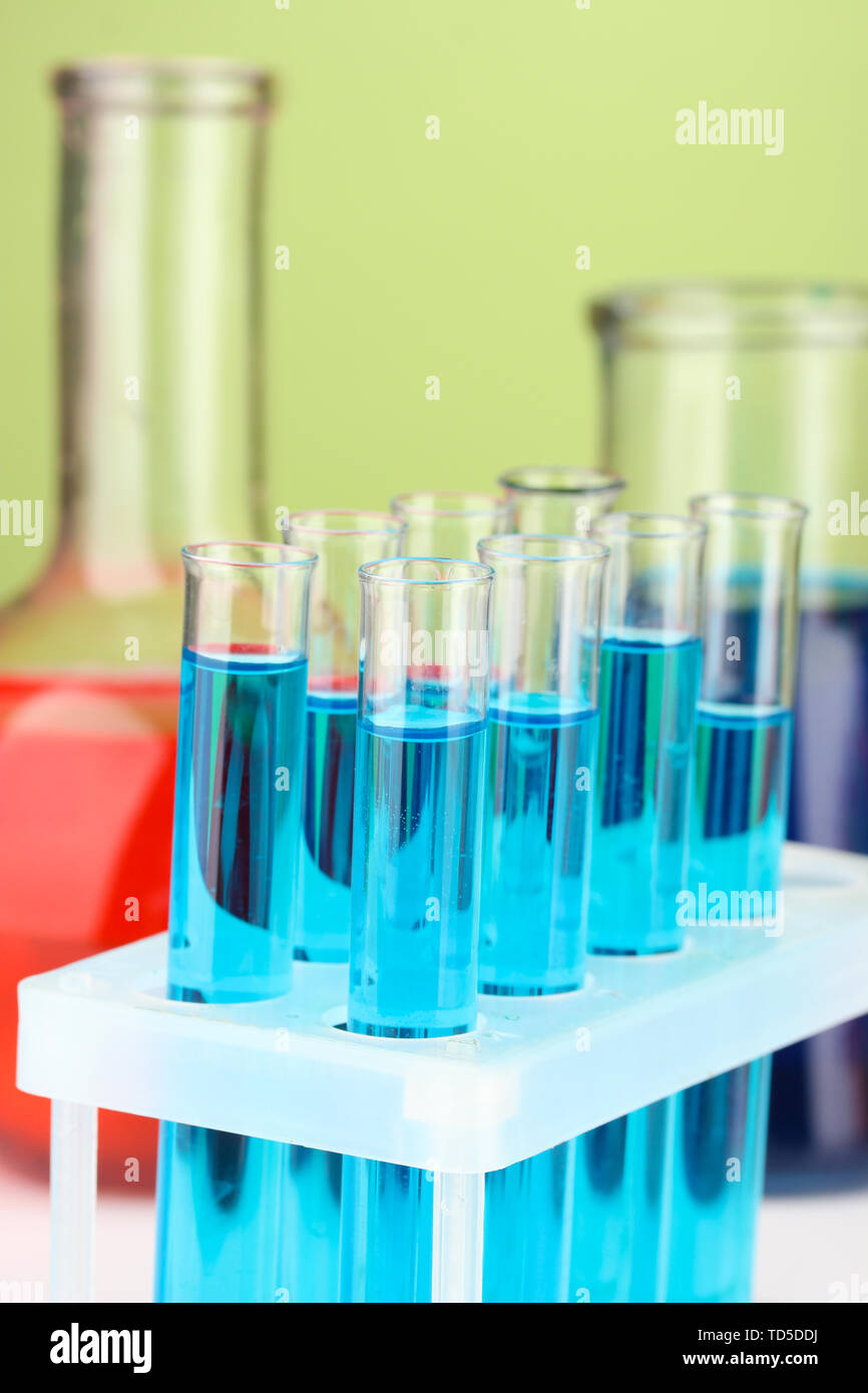 Test-tubes on color background Stock Photo - Alamy