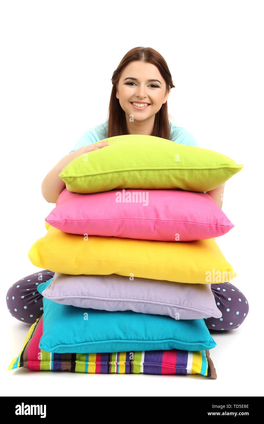 Beautiful young girl with pillows isolated on white Stock Photo - Alamy