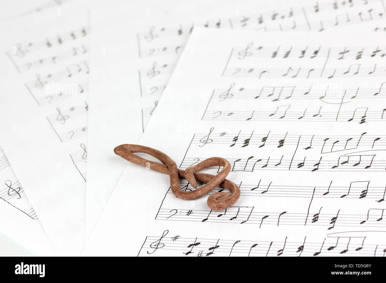 Treble clef on musical background Stock Photo - Alamy