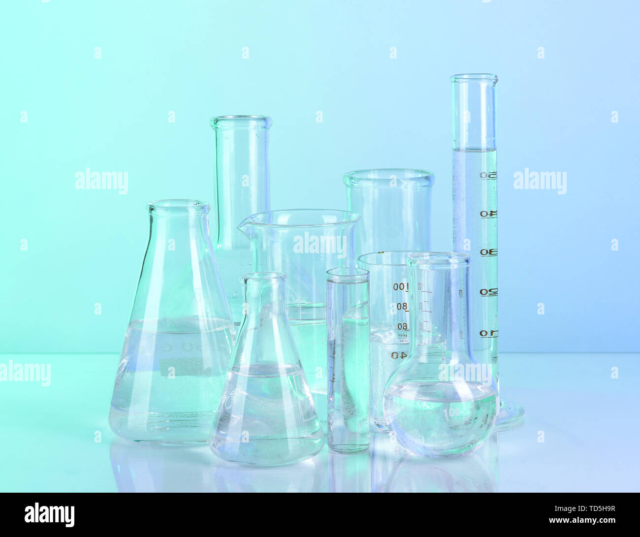 Test tubes on blue background Stock Photo - Alamy