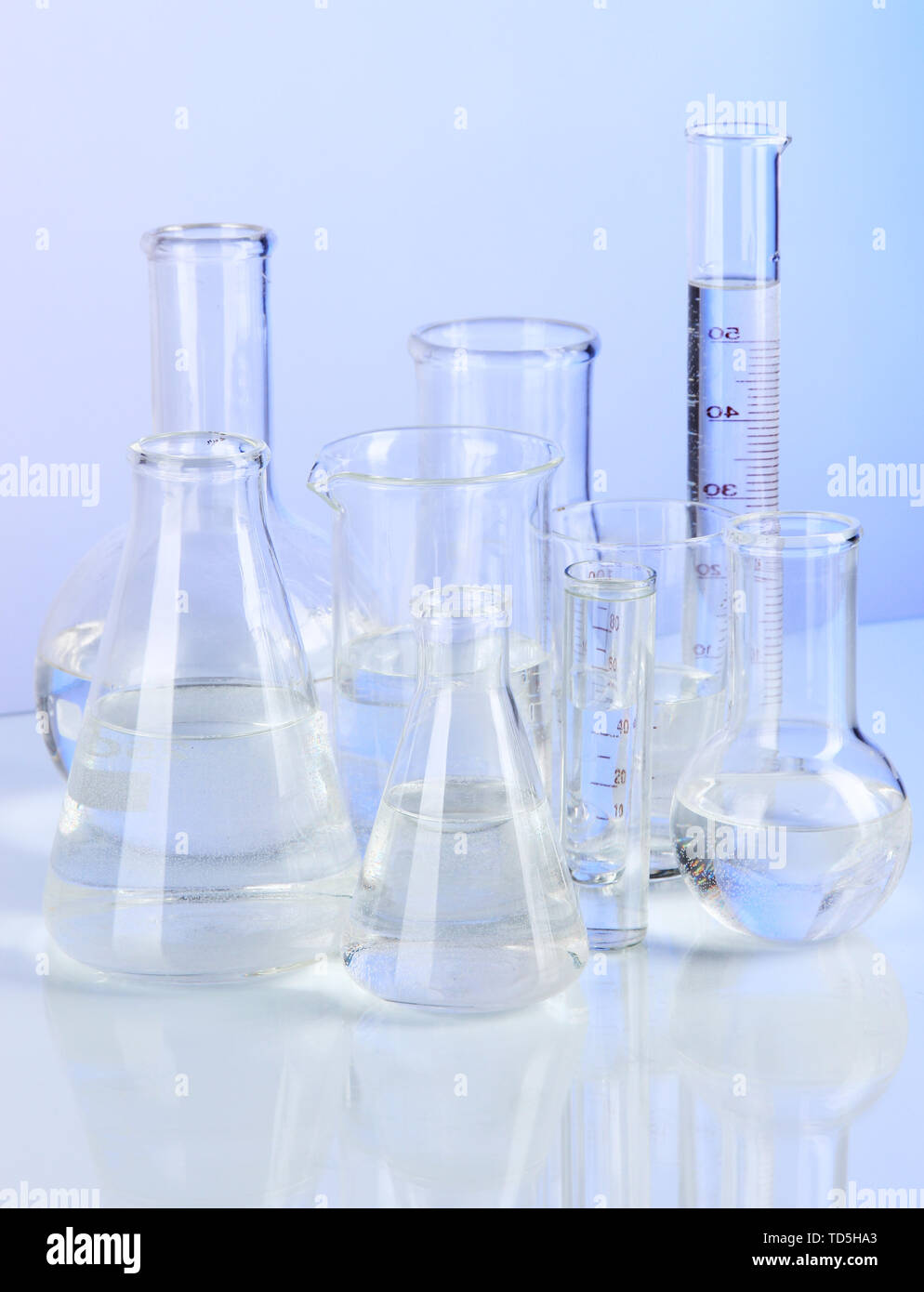 Test tubes on blue background Stock Photo - Alamy