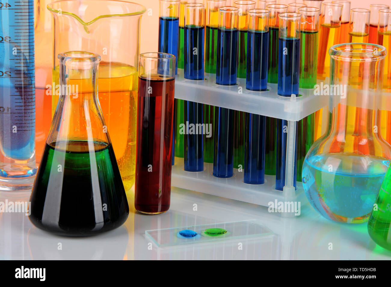Colorful test tubes on light background Stock Photo - Alamy
