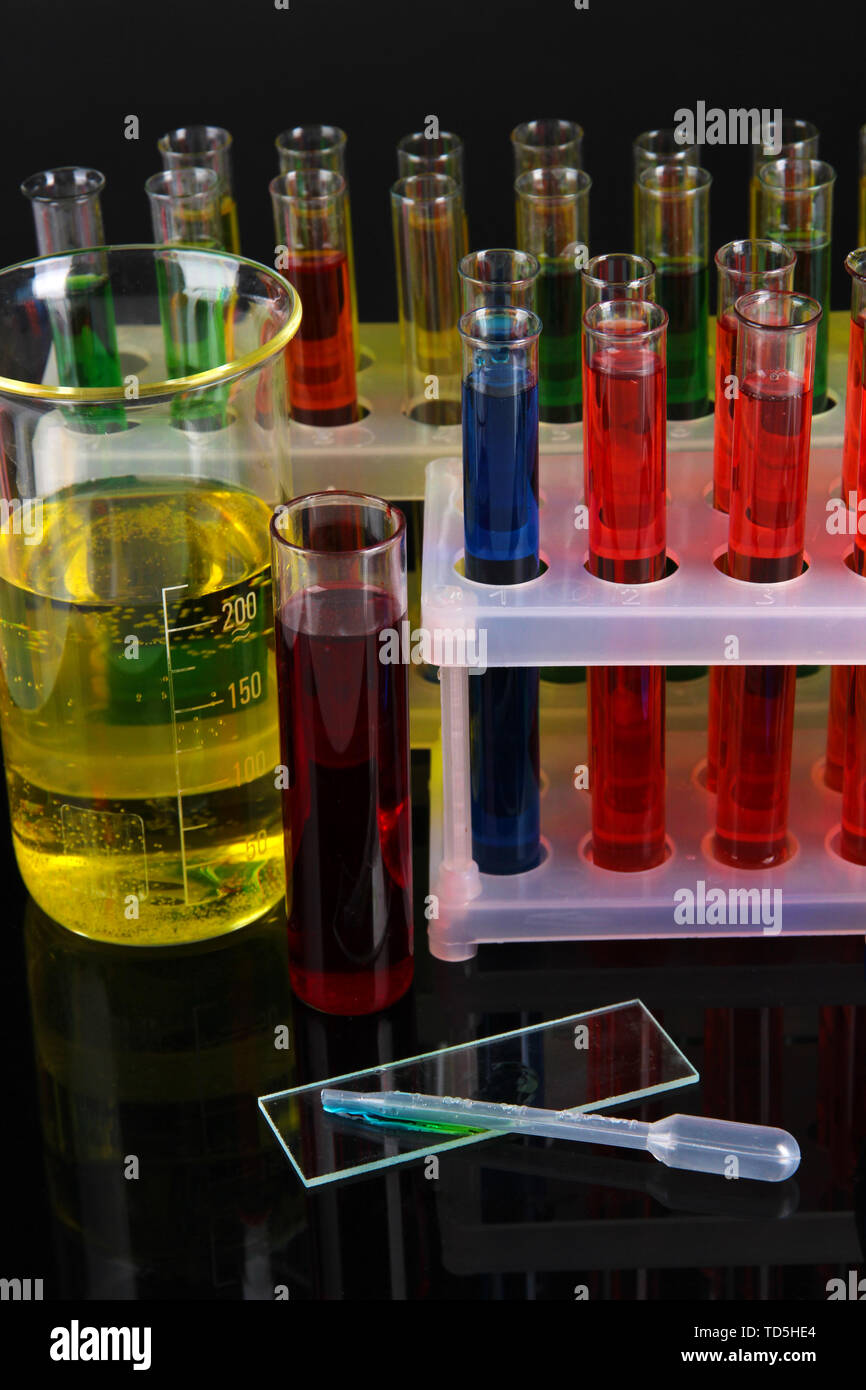 Colorful test tubes on bright background Stock Photo - Alamy
