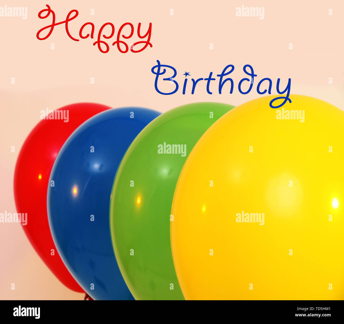 Four bright balloons on light background Stock Photo - Alamy