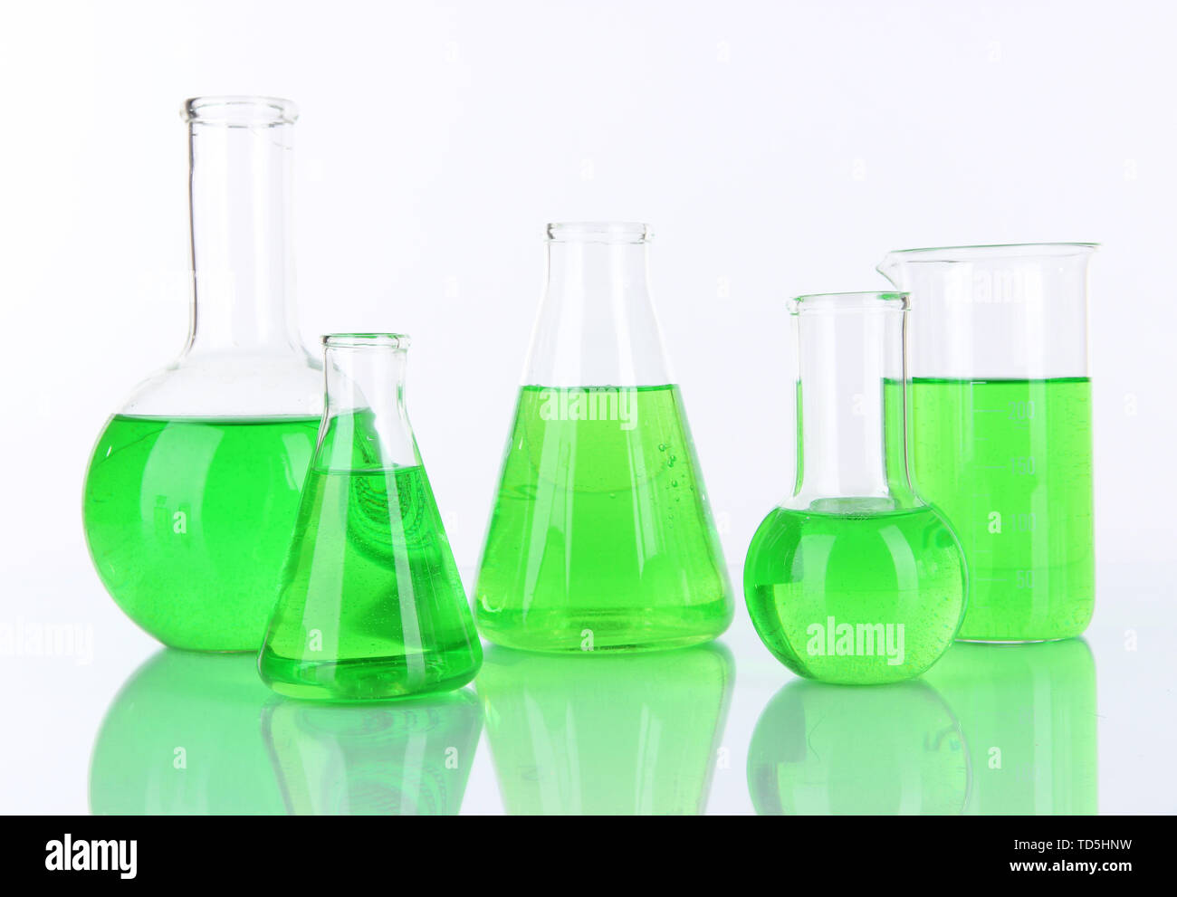 Test-tubes with green liquid isolated on white Stock Photo - Alamy