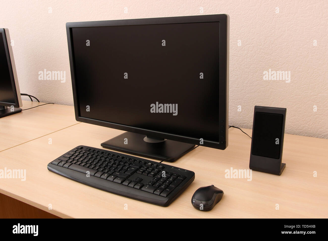 Computer on table in room Stock Photo - Alamy