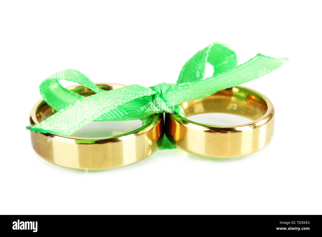 Wedding rings tied with ribbon isolated on white Stock Photo - Alamy