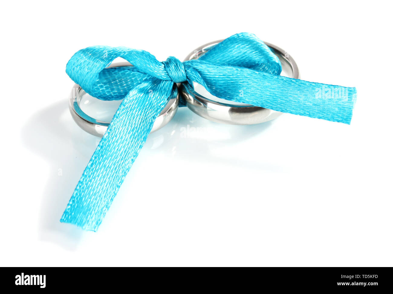 Wedding rings tied with ribbon isolated on white Stock Photo - Alamy
