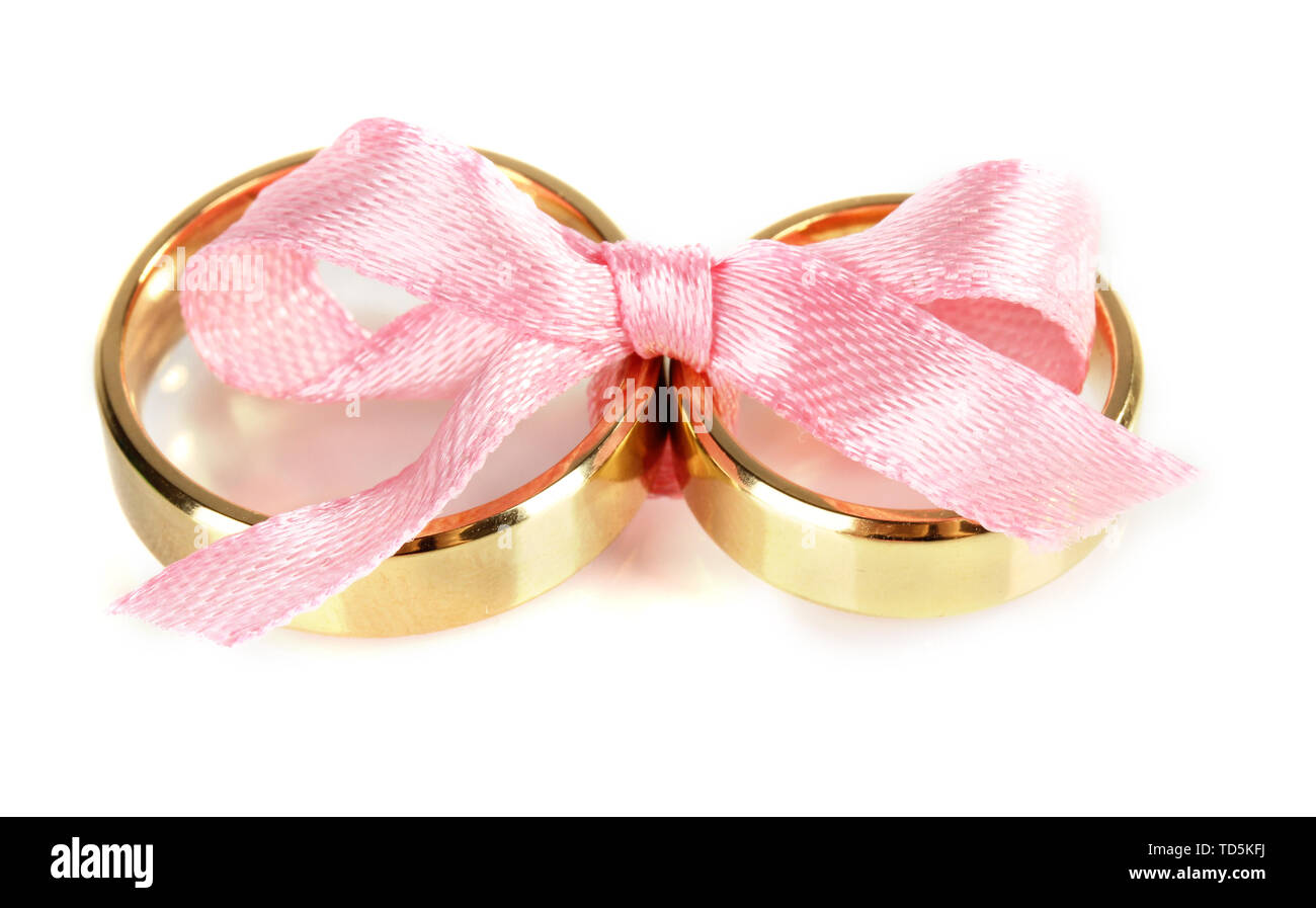 Wedding rings tied with ribbon isolated on white Stock Photo - Alamy