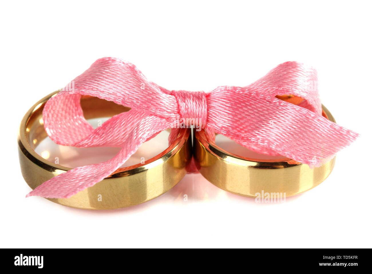 Wedding rings tied with ribbon isolated on white Stock Photo - Alamy