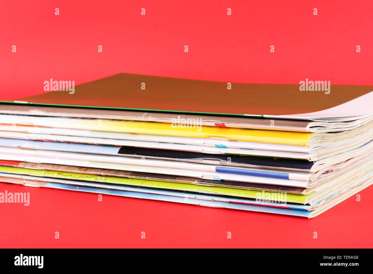 Many magazines on red background Stock Photo - Alamy