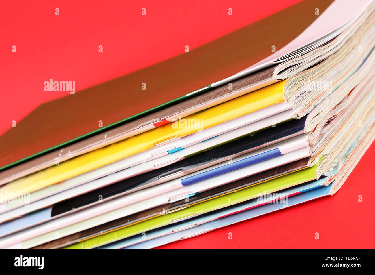 Many magazines on red background Stock Photo - Alamy
