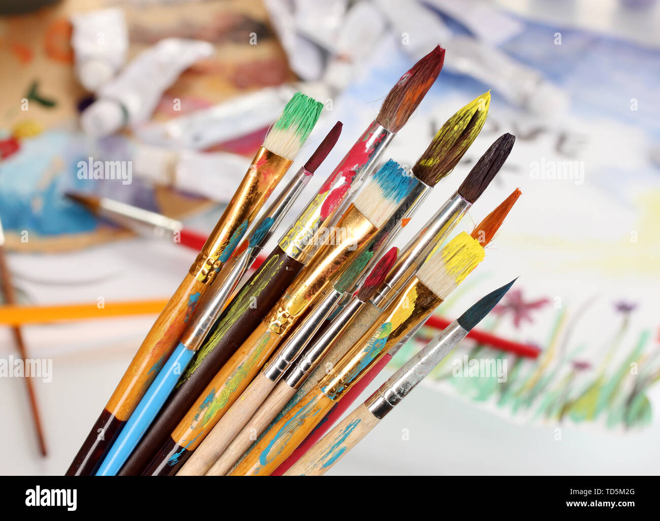 Many brush in paint on bright background Stock Photo - Alamy