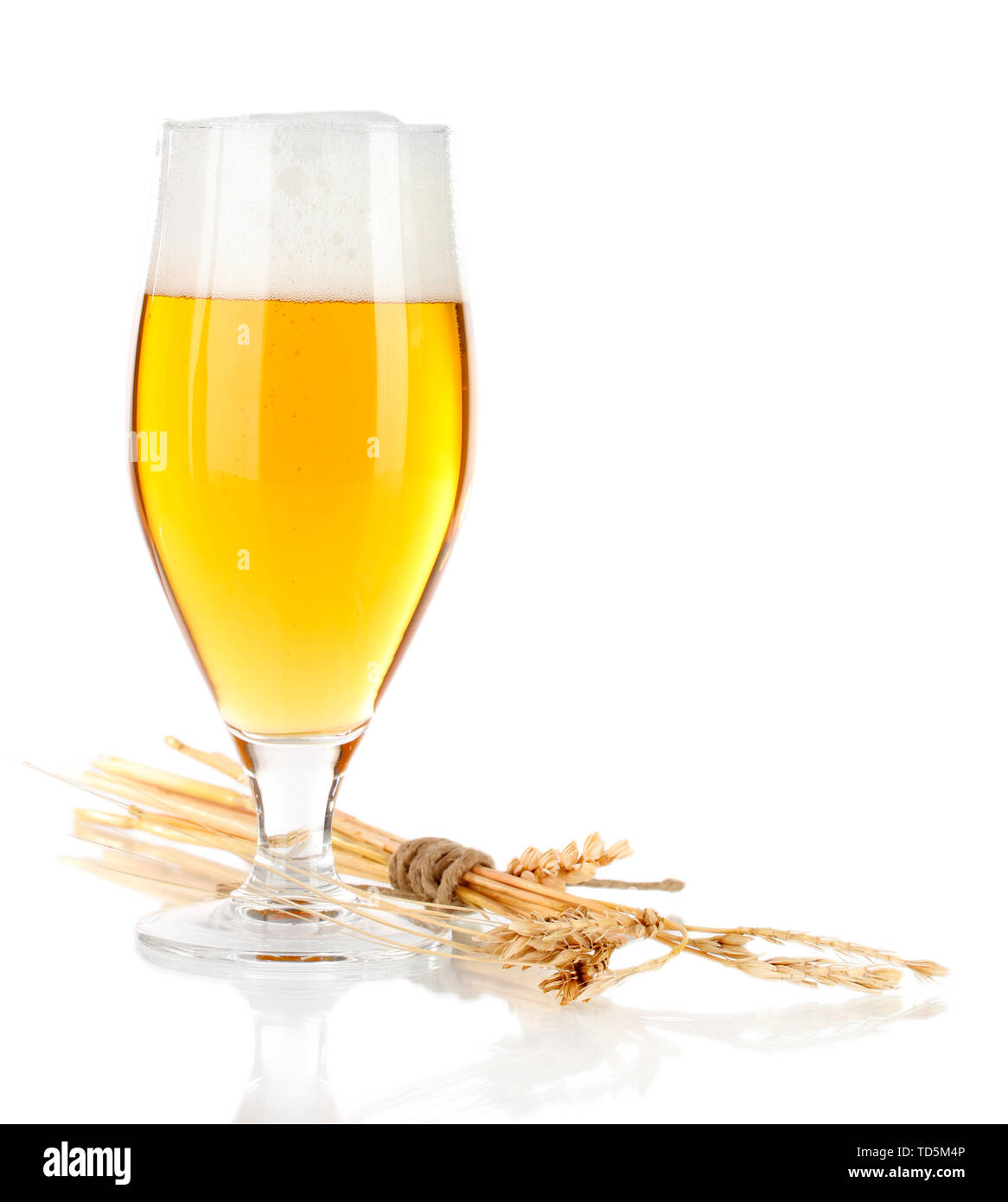 Glass of beer with spike lets on light yellow background Stock Photo ...