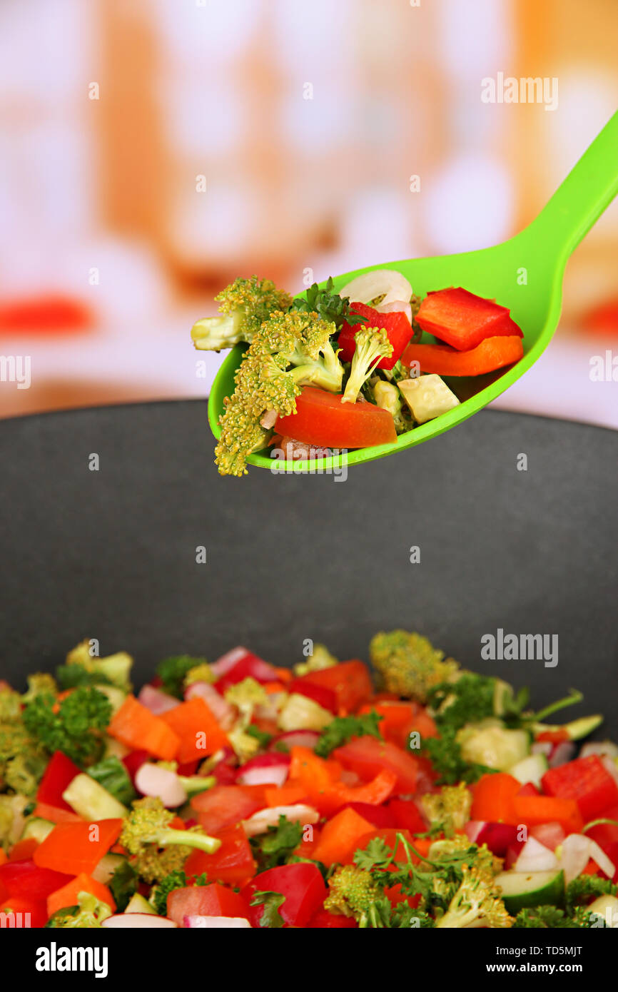 Vegetable ragout in wok, on bright background Stock Photo - Alamy
