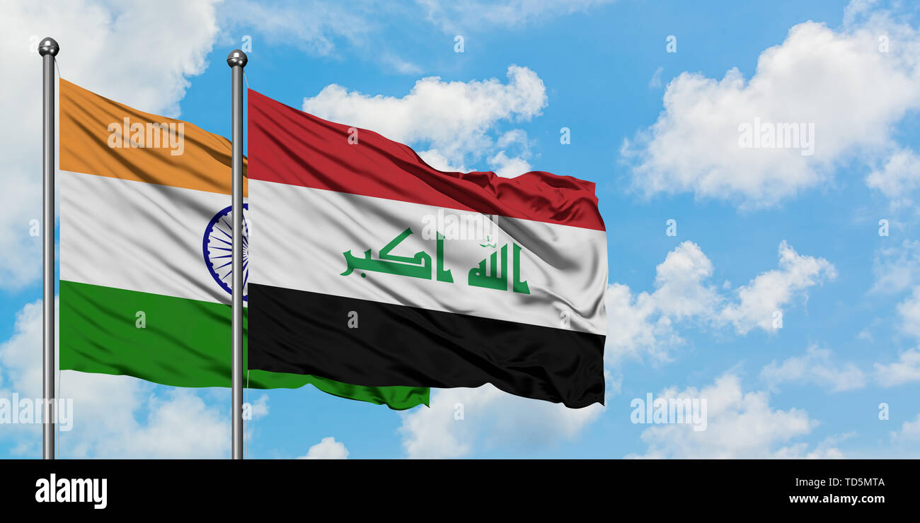 India and Iraq flag waving in the wind against white cloudy blue sky ...