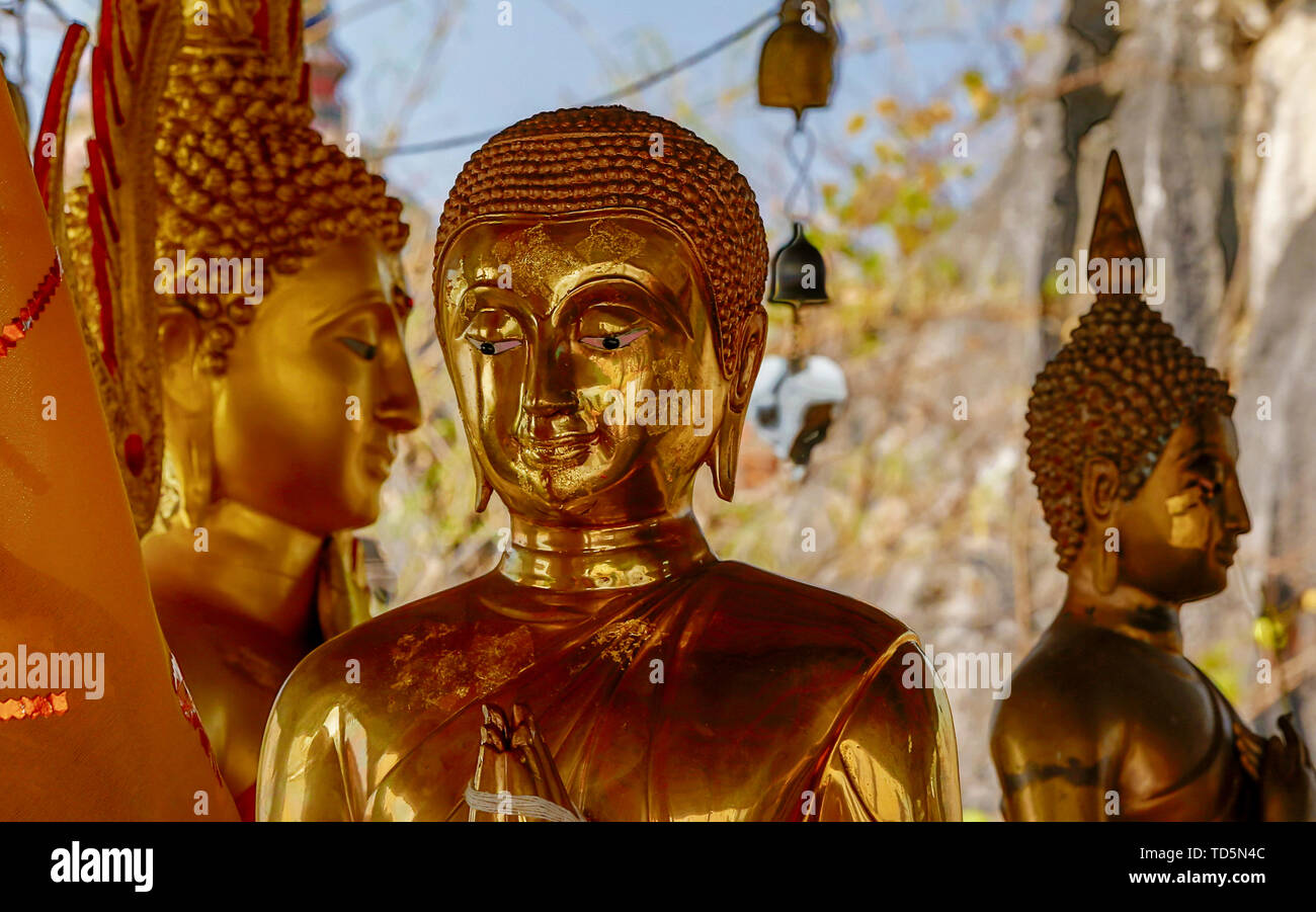 Three Golden Buddha Statues Together in a Tableau Stock Photo - Alamy