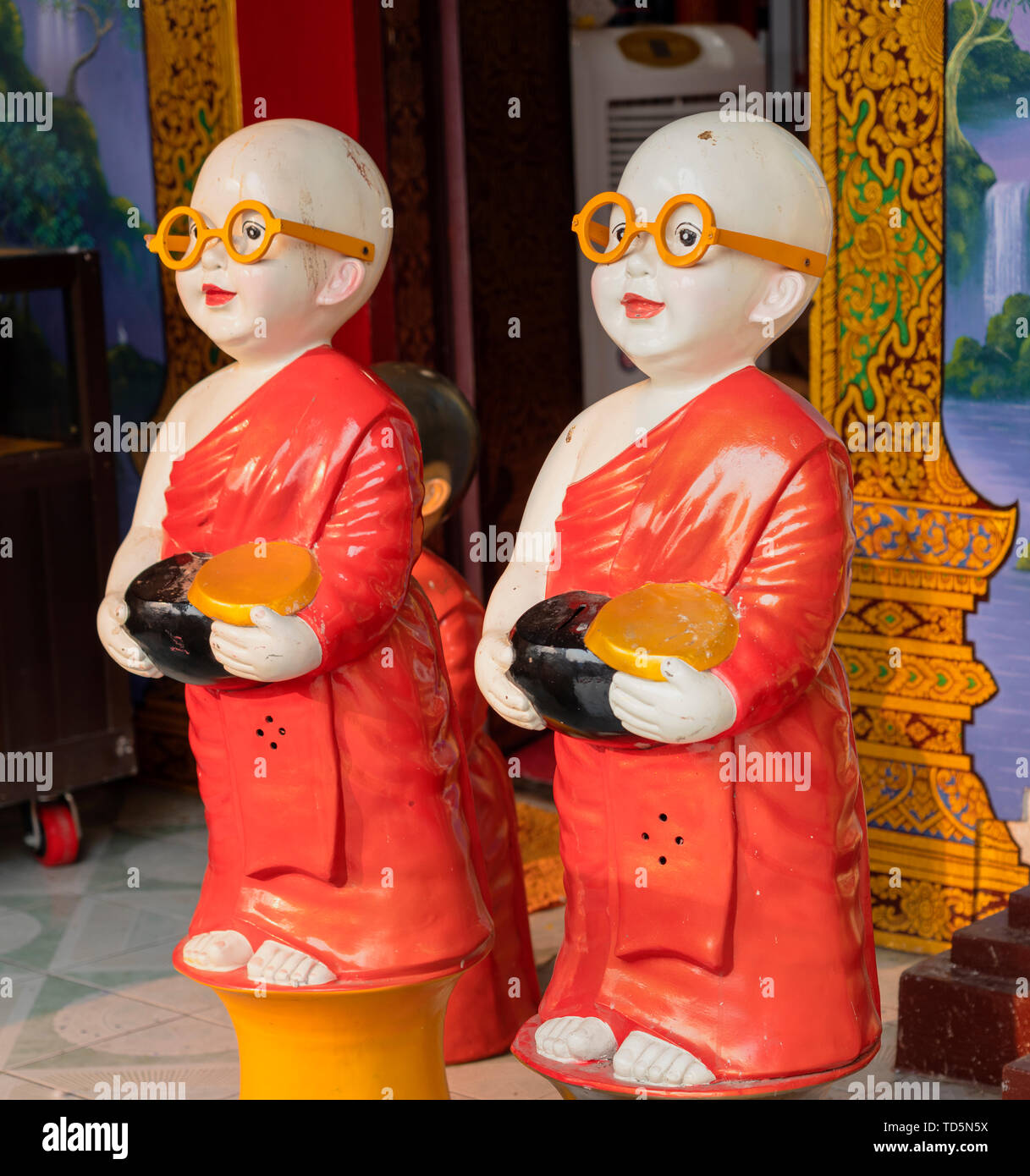 Plaster Statues of Two Young Student Monks Welcome You Stock Photo - Alamy