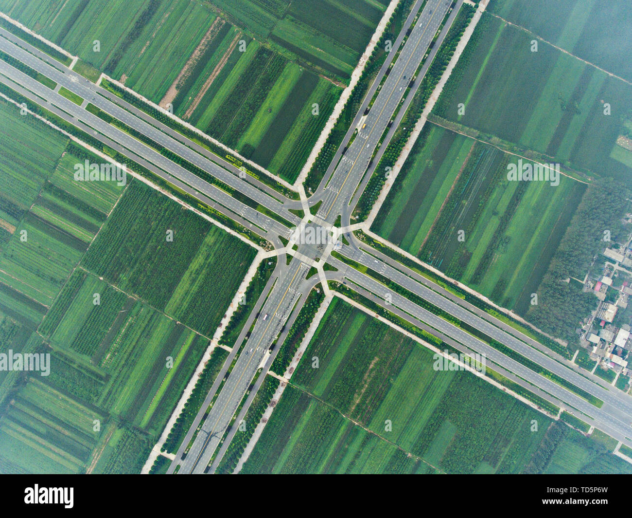 A very large intersection, at the junction of the city and the ...