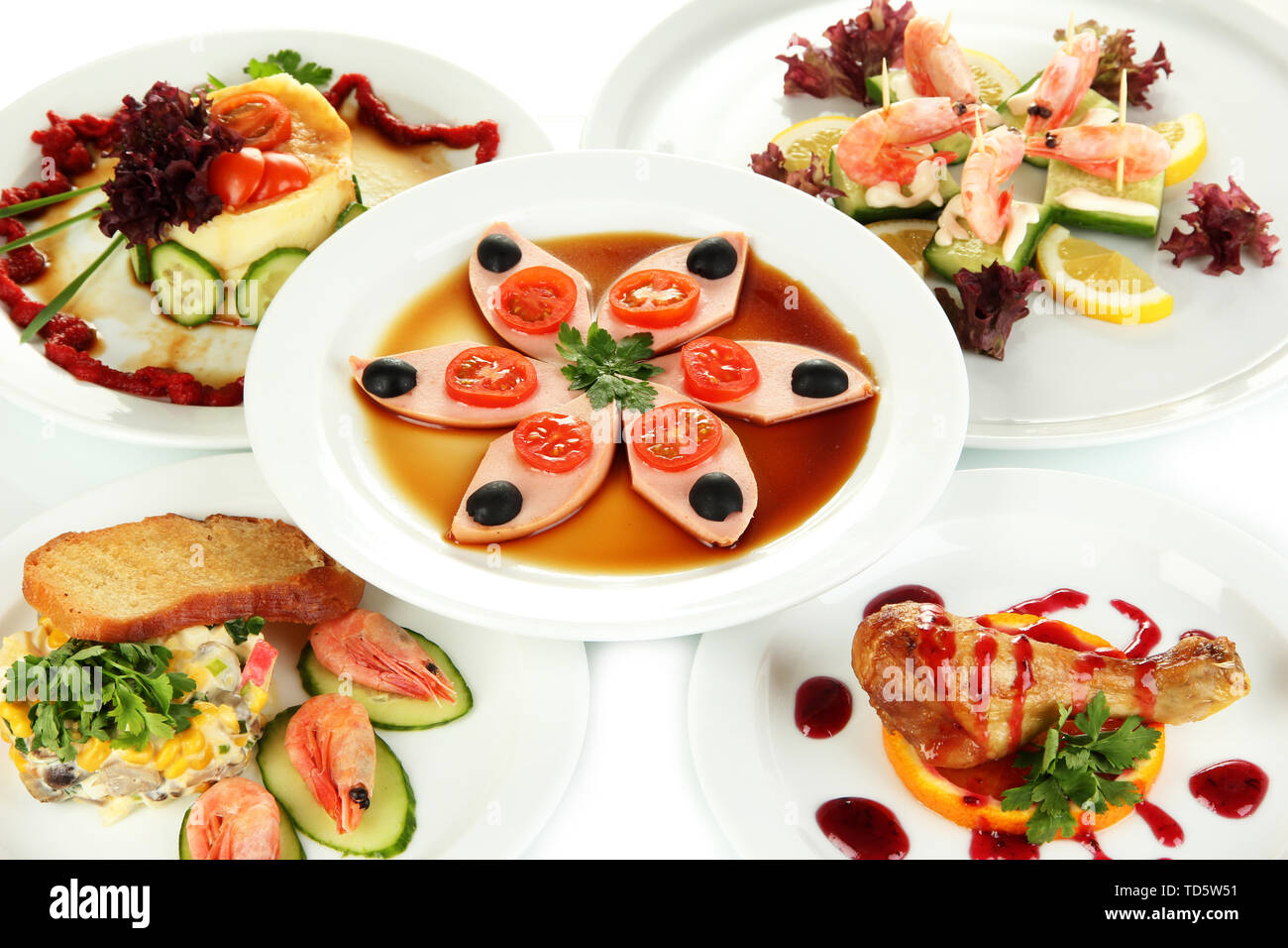 Small portions of food on big white plates close up Stock Photo - Alamy