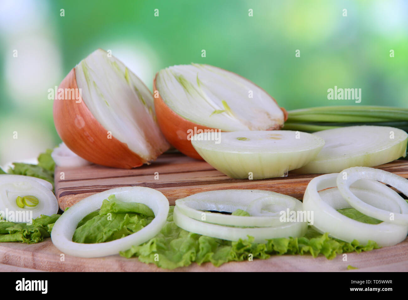 Composition with herbs and onions on nature background Stock Photo - Alamy