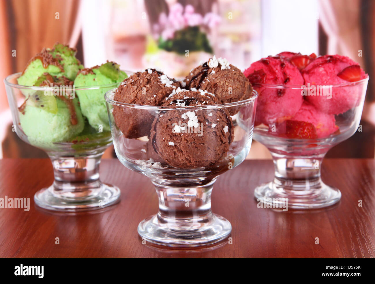 Delicious ice cream on table in room Stock Photo - Alamy