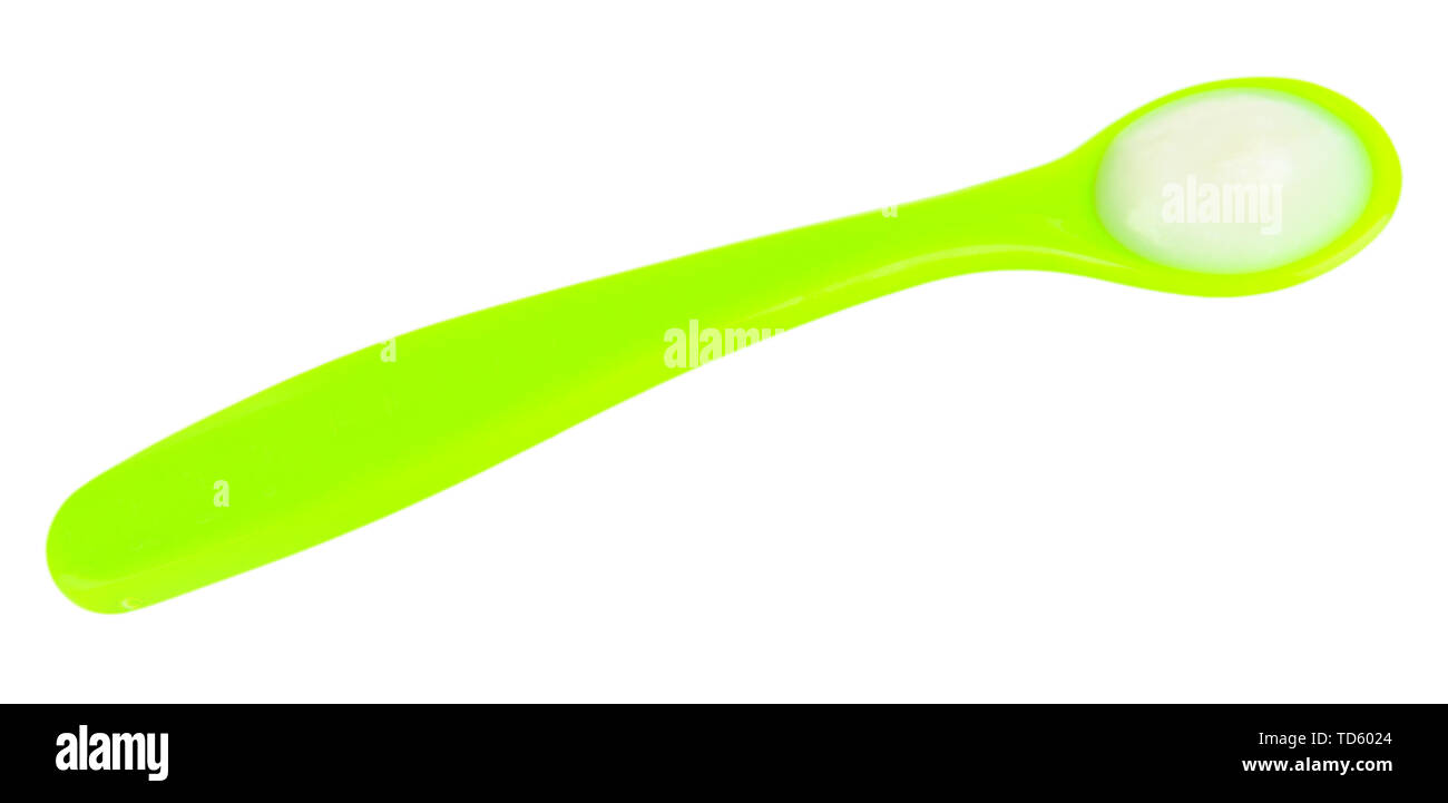 Green spoon for baby food isolated on white Stock Photo - Alamy