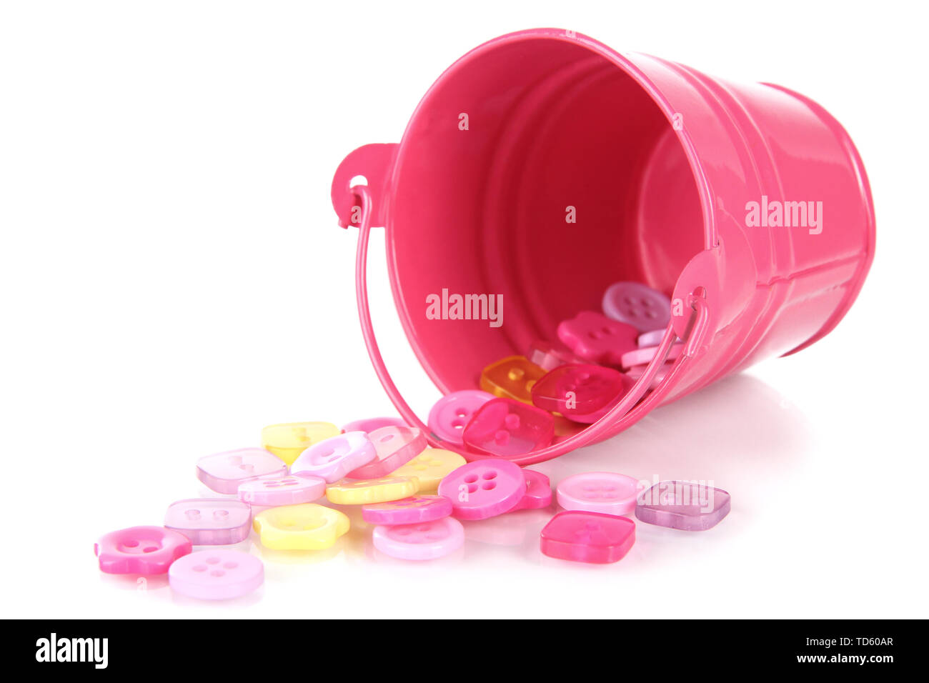 Colorful buttons strewn from bucket isolated on white Stock Photo - Alamy