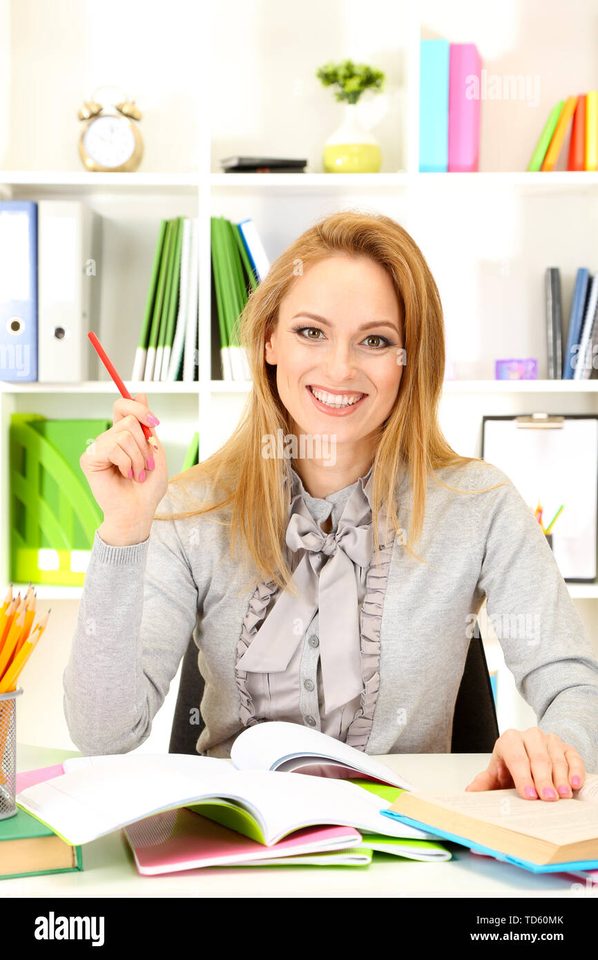 Portrait of teacher woman working in classroom Stock Photo - Alamy