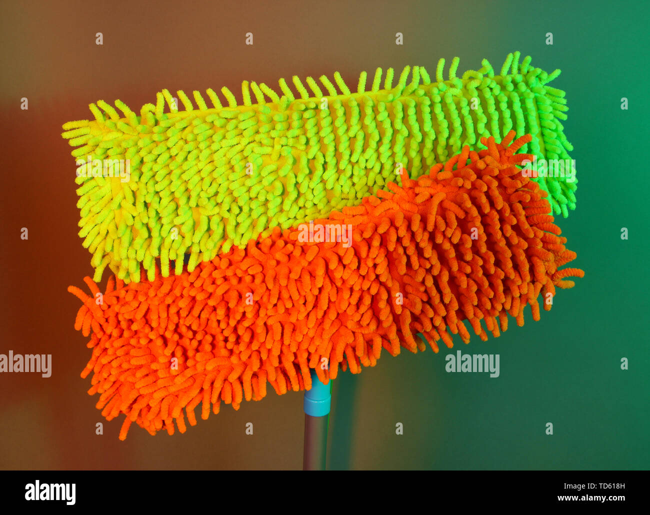 Two mops for floor on bright background Stock Photo - Alamy