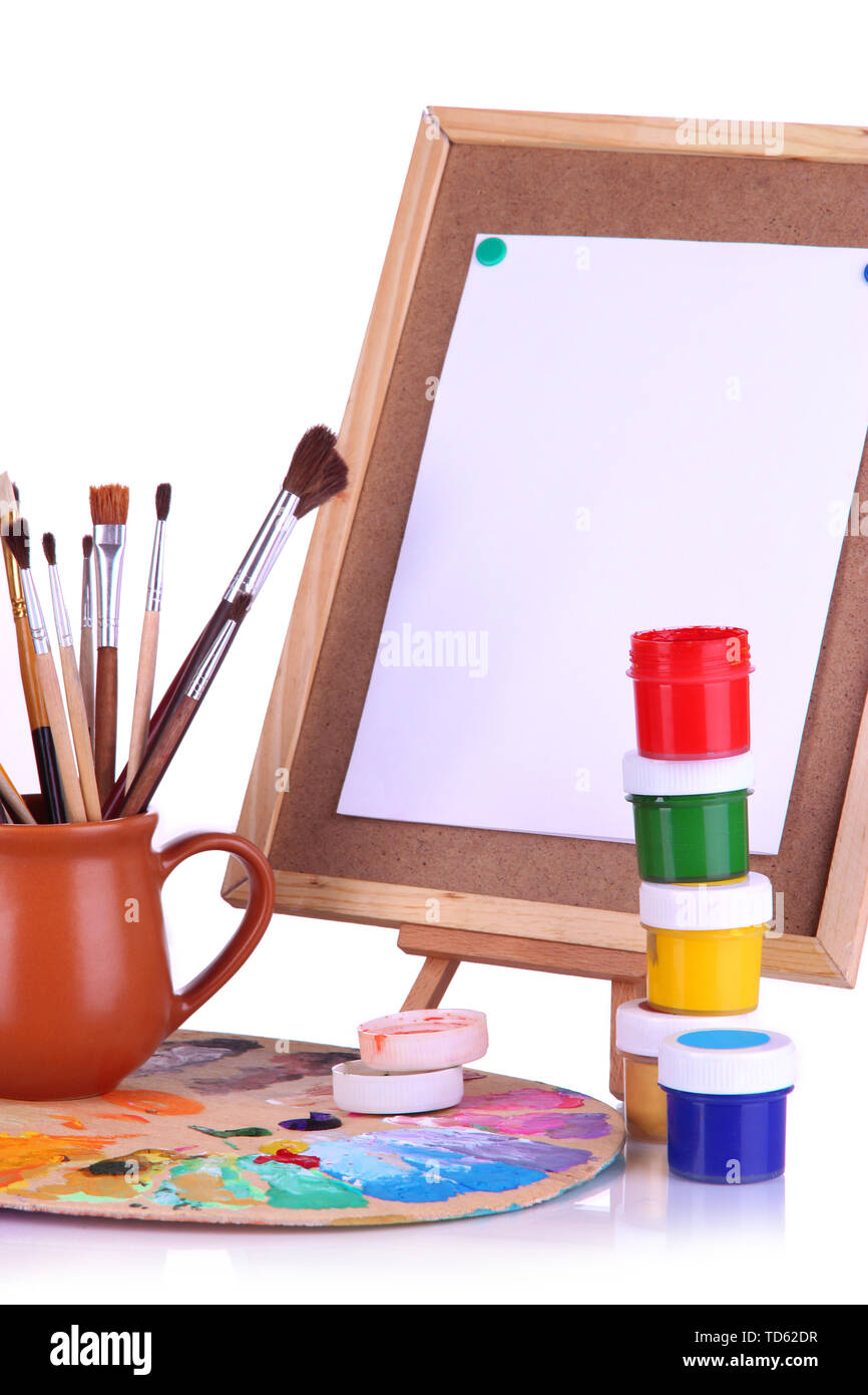 Small easel with sheet of paper and art supplies isolated on white ...