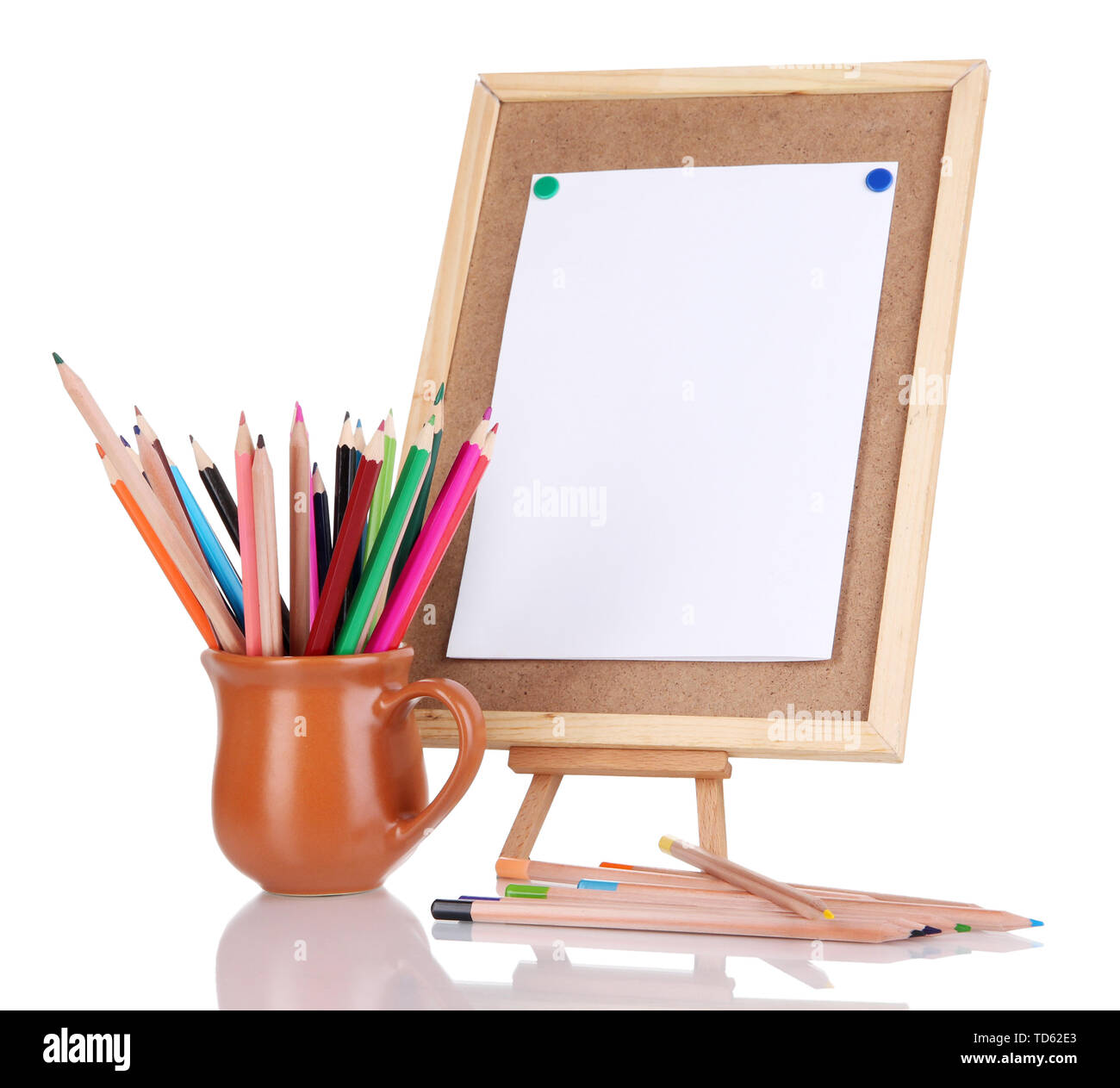 Small easel with sheet of paper with art supplies isolated on white ...