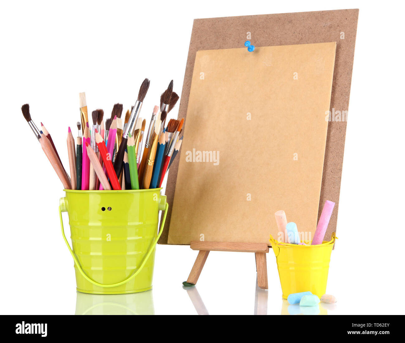 Small easel with sheet of paper with art supplies isolated on white ...