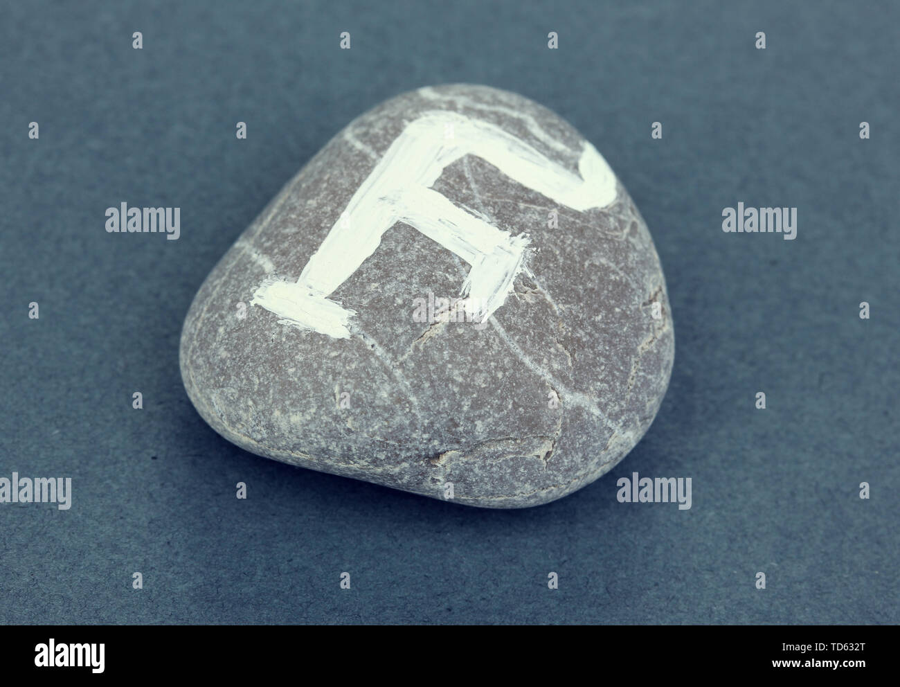 Fortune telling with symbols on stone on grey background Stock Photo ...