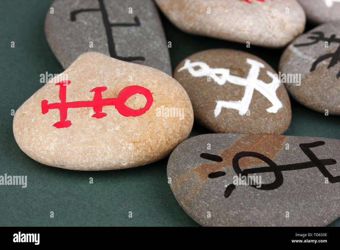 Fortune telling with symbols on stones on grey background Stock Photo ...